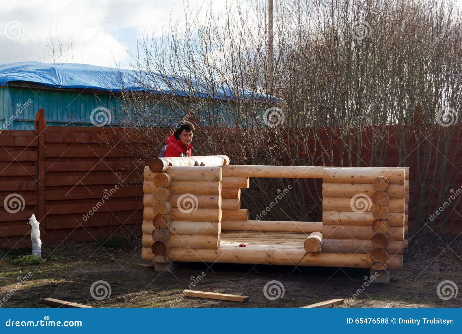 Man Builds Structure Made of Logs Stock Photo - Image of logs, bare ...
