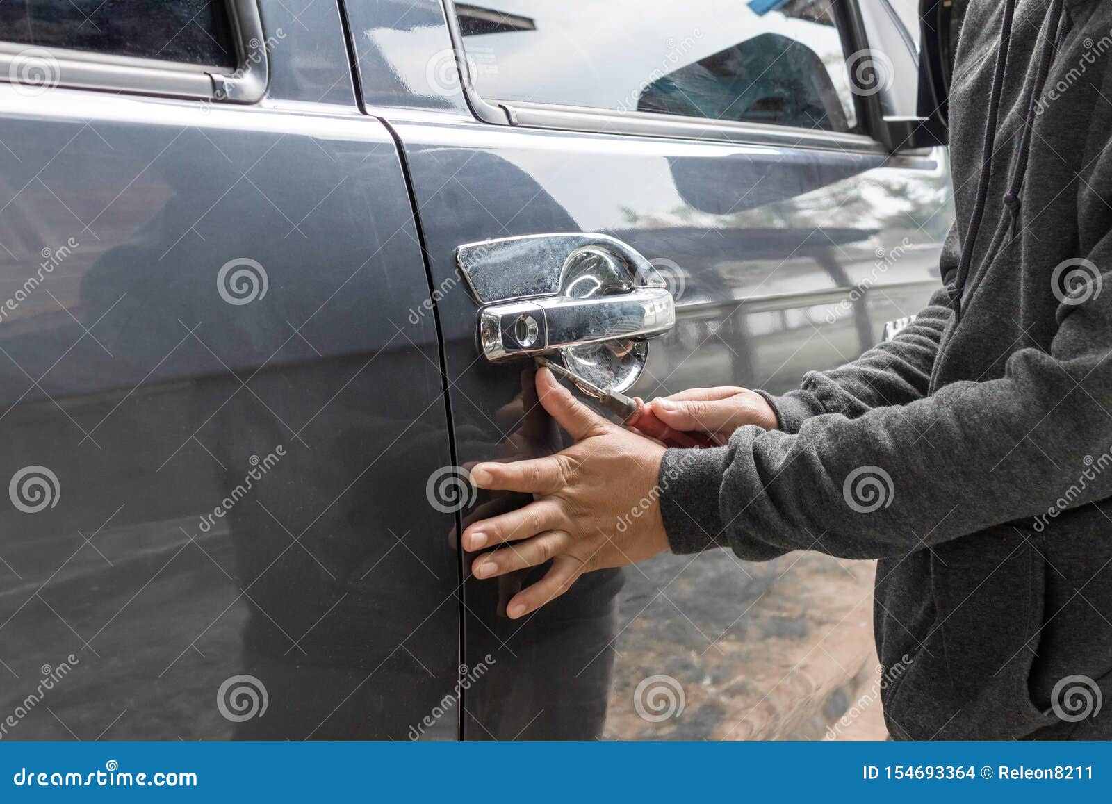 Man burglar stealing car stock photo. Image of break - 154693364