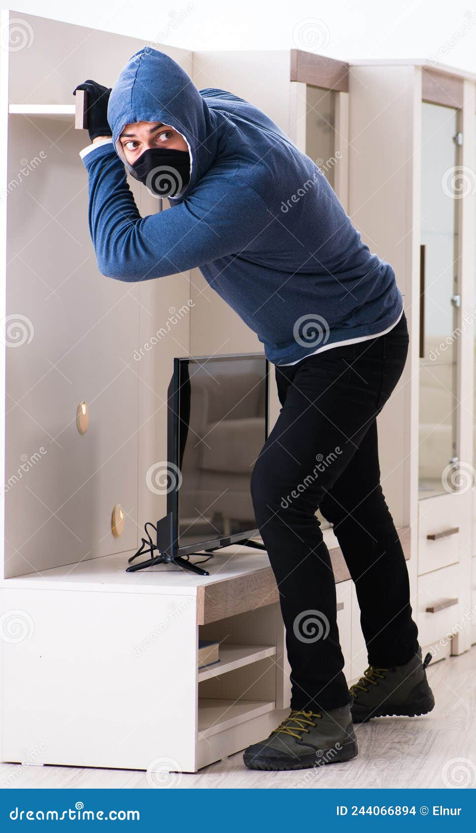 Man Burglar Stealing Tv Set from House Stock Photo - Image of ...