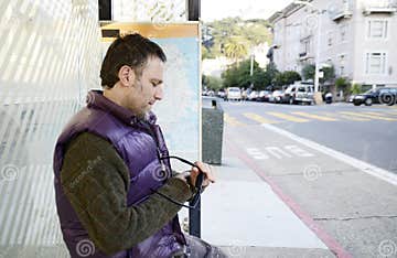 Man at a bus stop stock photo. Image of padded, white - 22715200