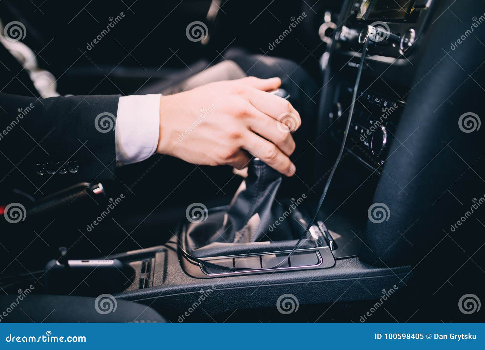 Businessman in a Business Suit in the Car Changes Gear Stock Image ...