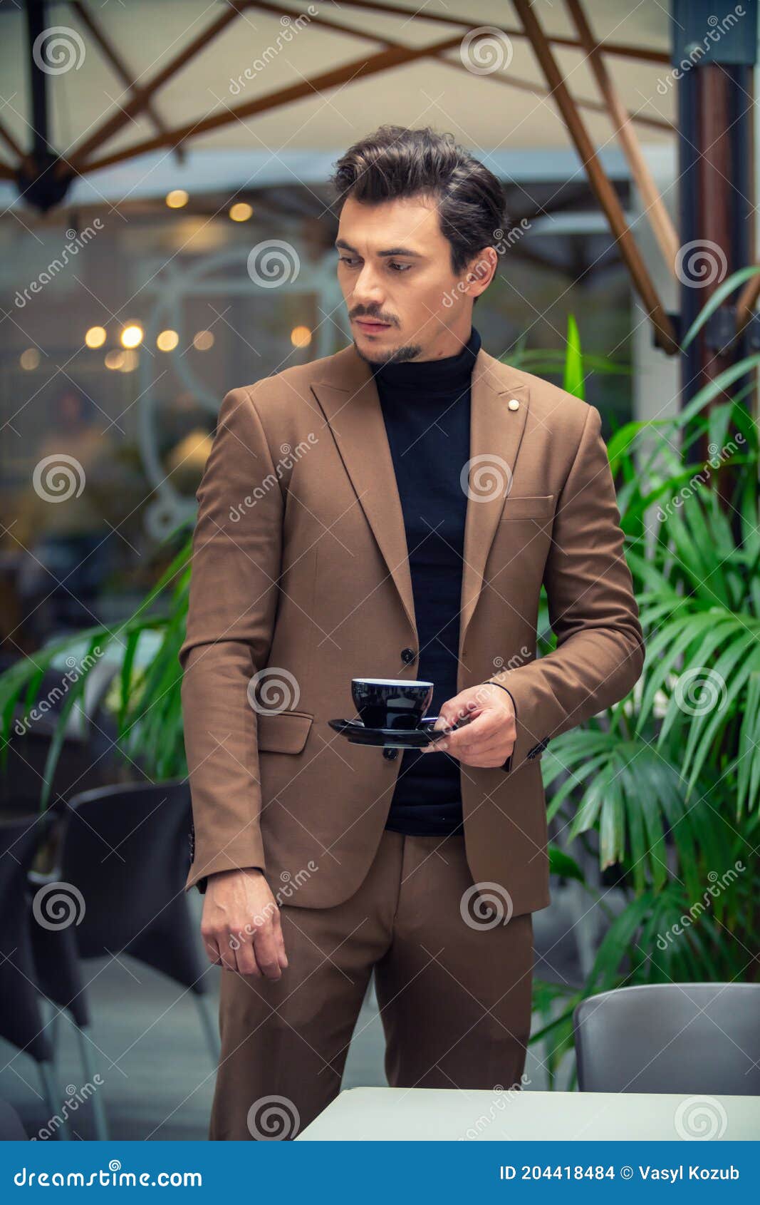 A Man in a Business Suit Drinking Tea Stock Photo - Image of adult ...