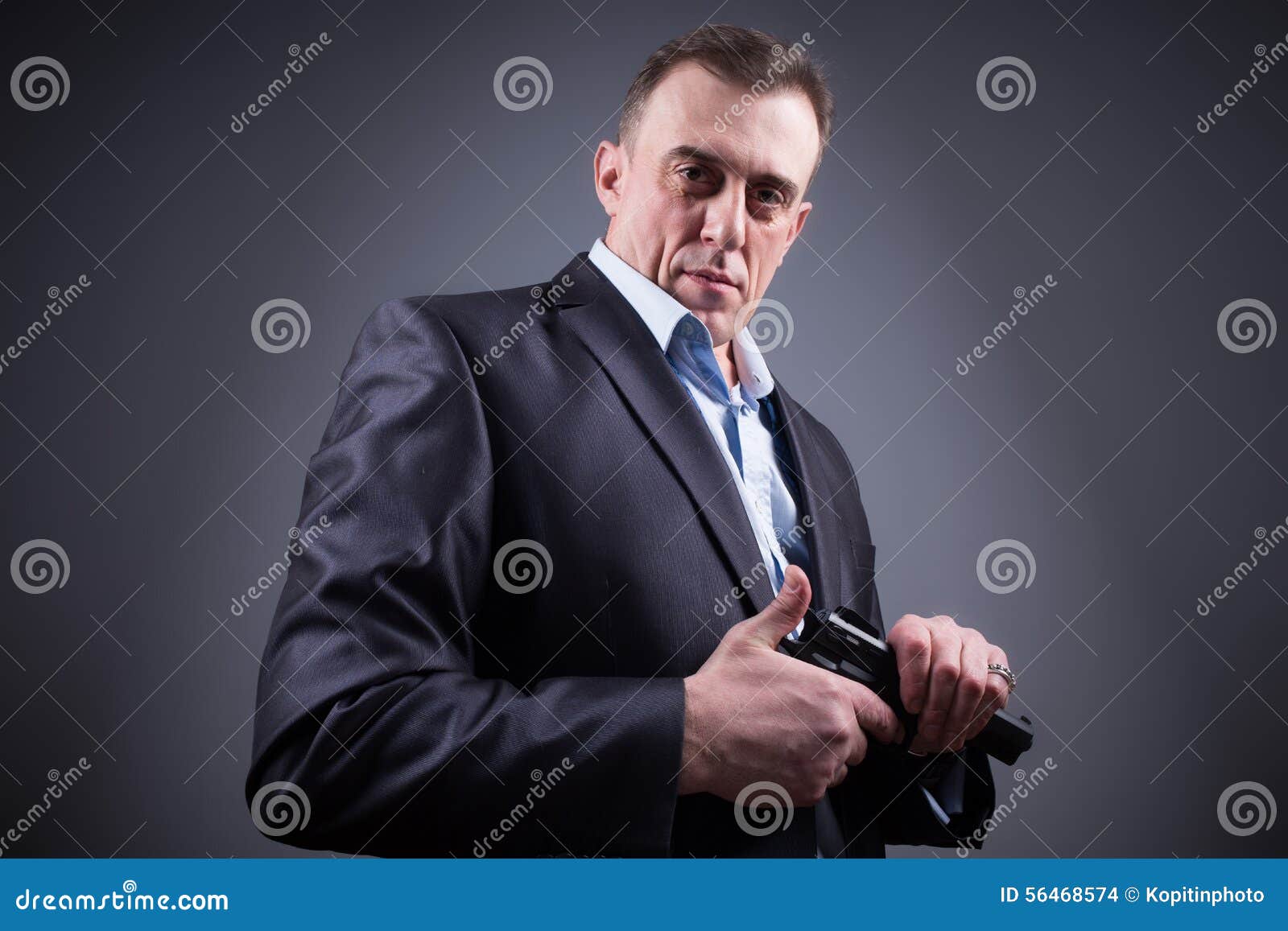 Man in a Business Suit with a Gun Stock Photo - Image of security ...