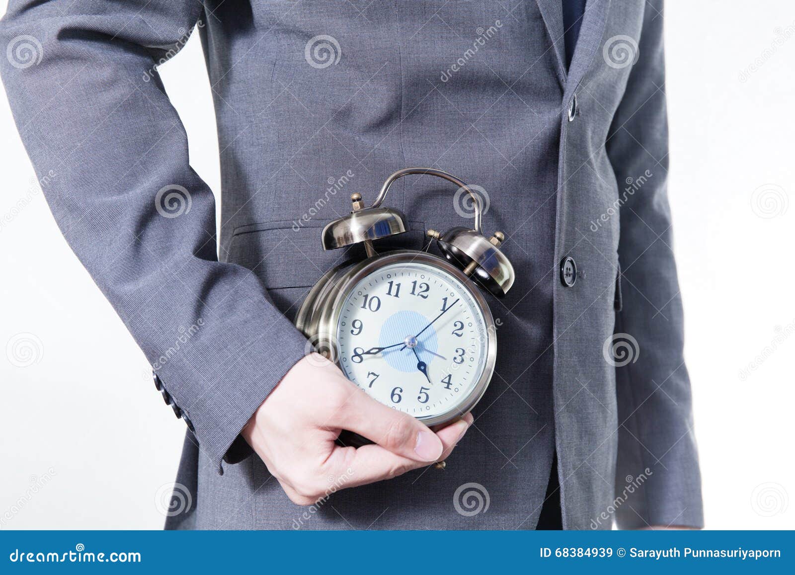 Man in Business Suit Holding a Clock - on Time and Business Concept ...