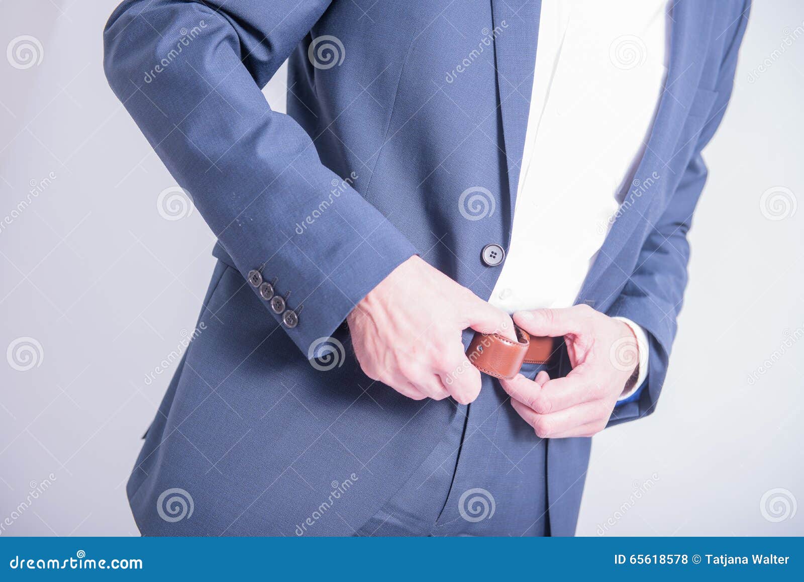 Man buttoning his pants on stock photo. Image of body - 65618578