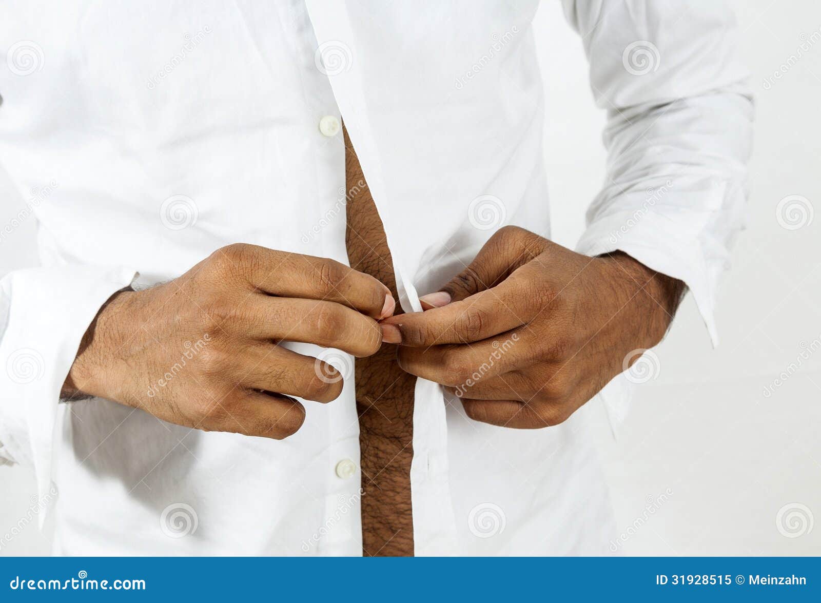 Man buttoning his shirt stock image. Image of person - 31928515