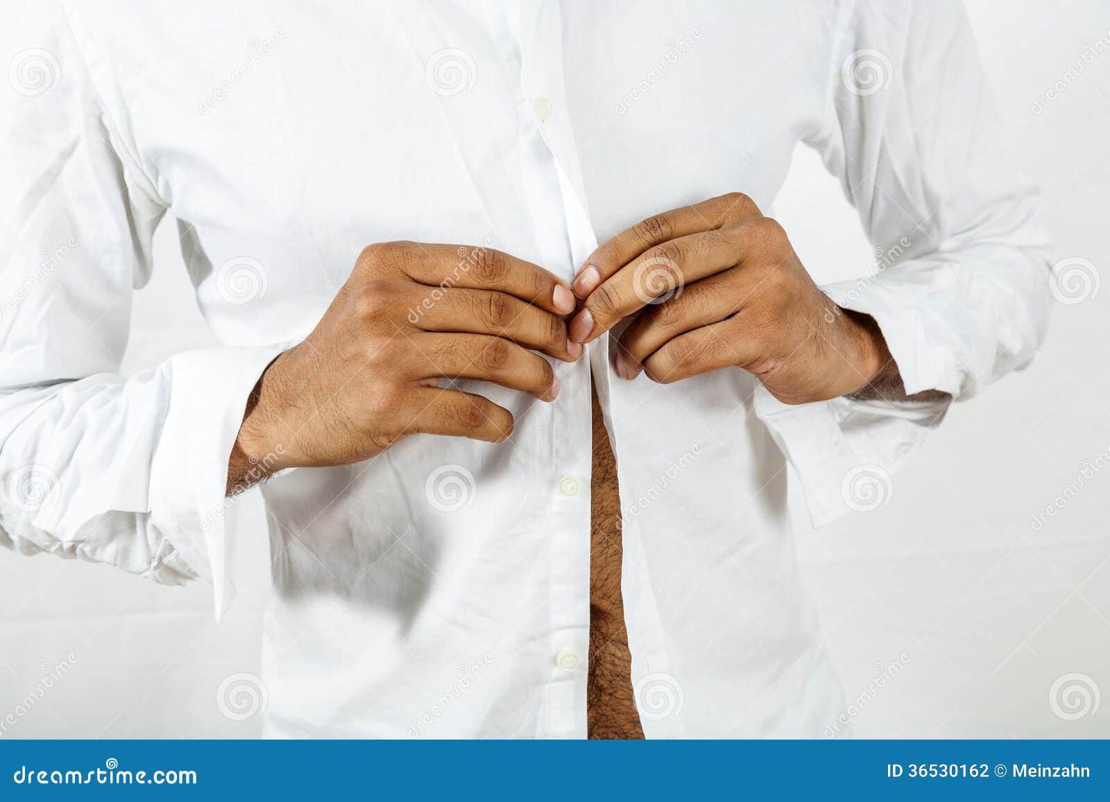 Man buttoning his shirt stock photo. Image of color, authentic - 36530162