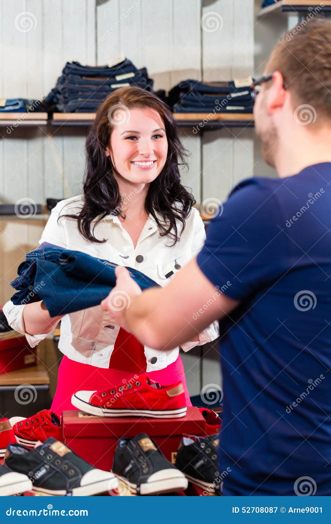Man buying jeans in shop stock image. Image of jeans - 52708087