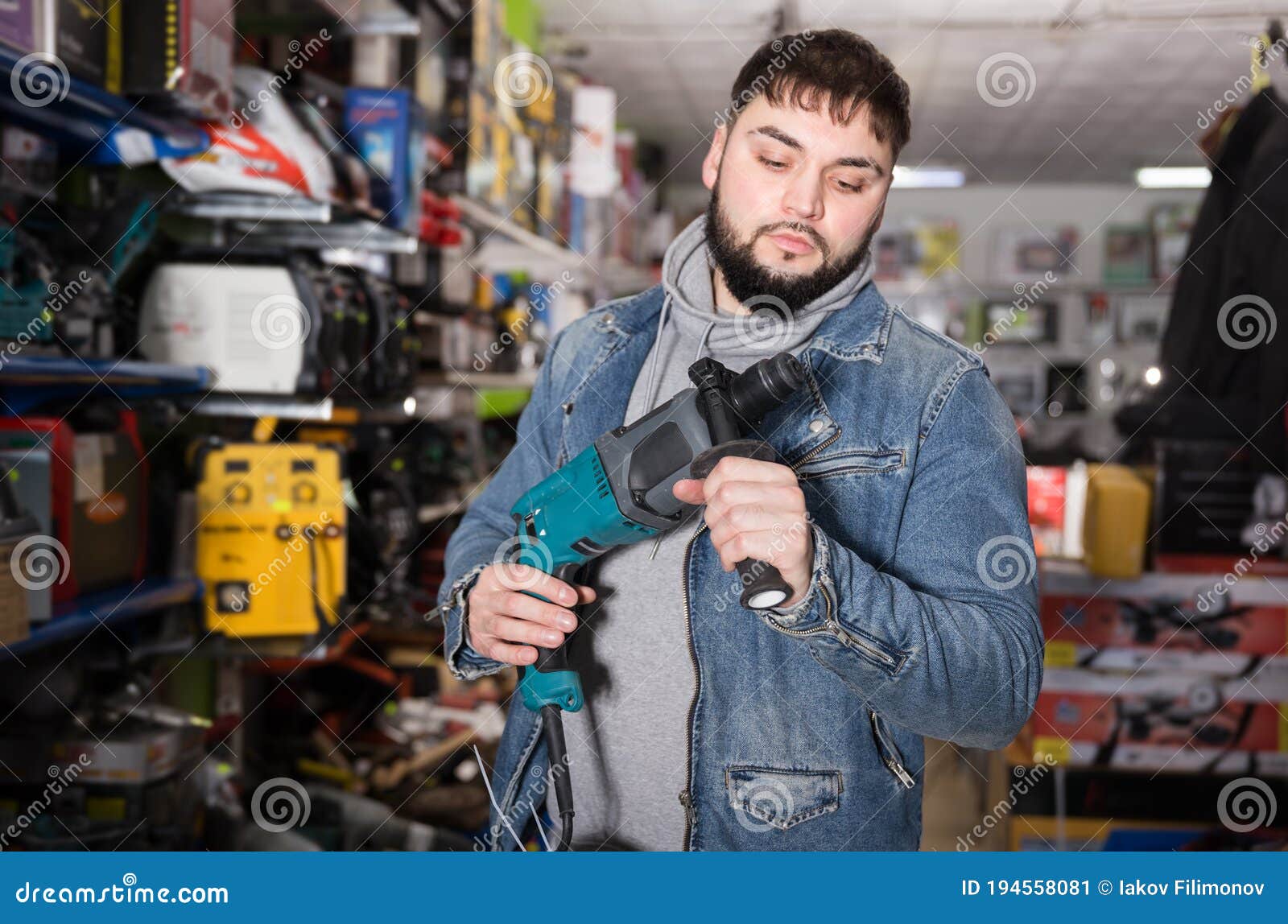 Man Buys Hammer Drill in Tools Store Stock Image - Image of indoors ...