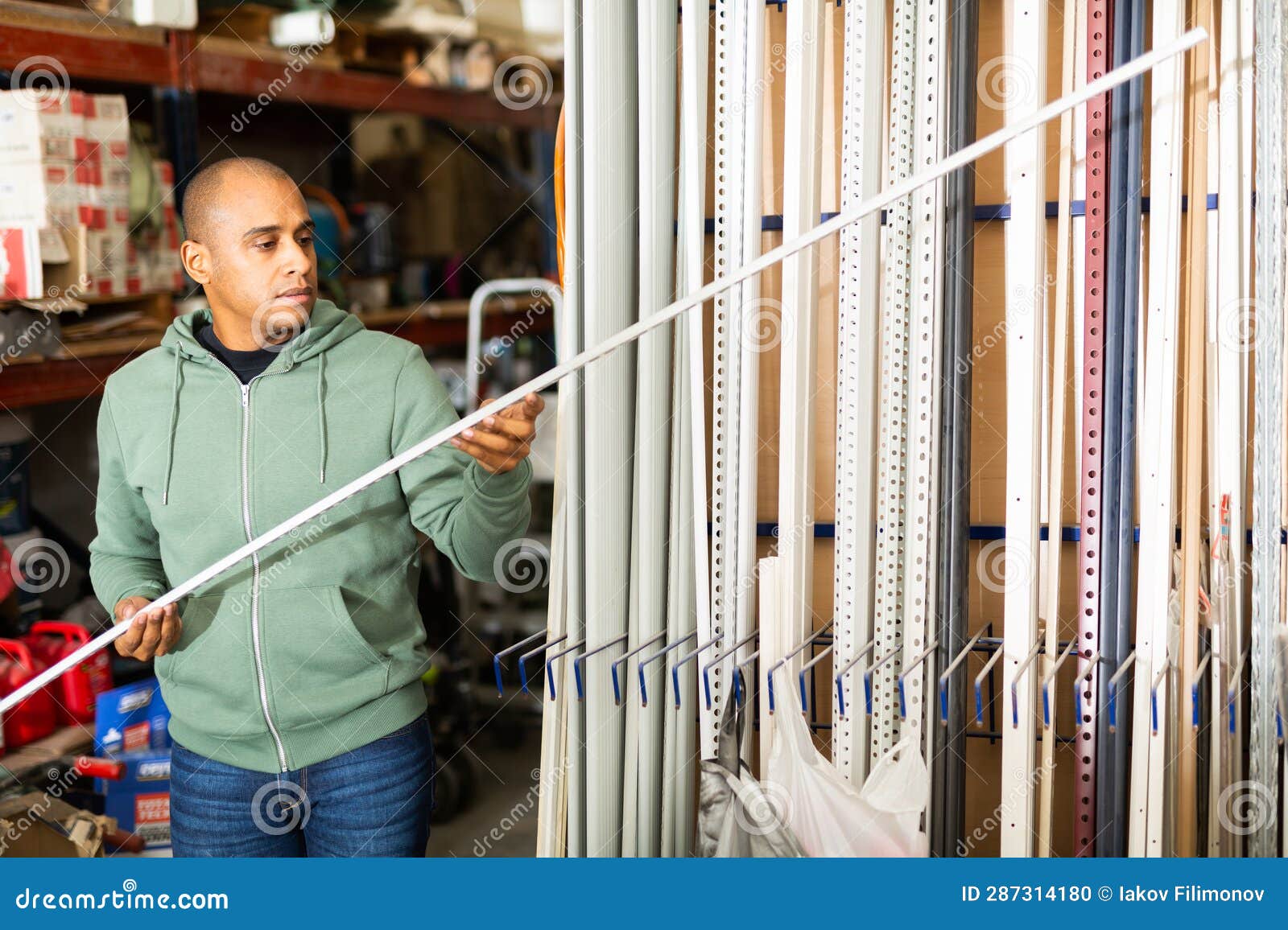 Man Buys Plastic Corners for Repair in Hardware Store Stock Photo ...