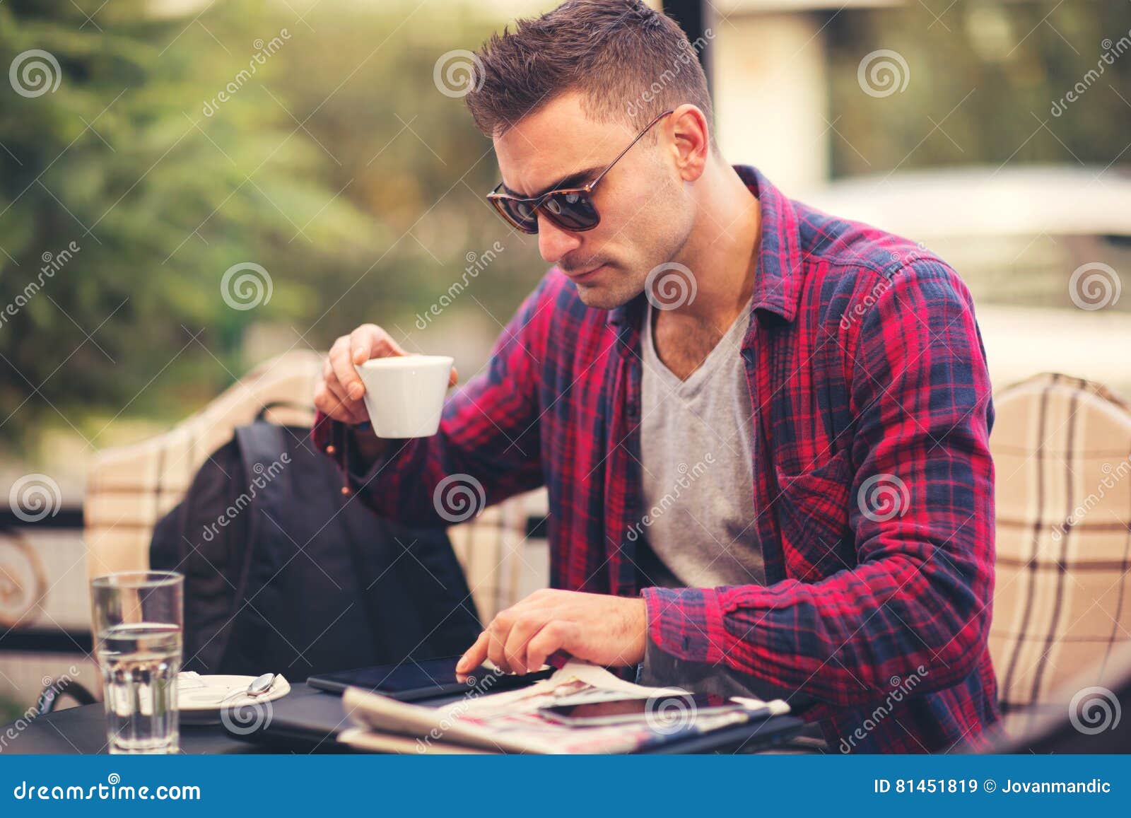 Man at a Cafe Table Reading a Newspaper Stock Image - Image of adult ...