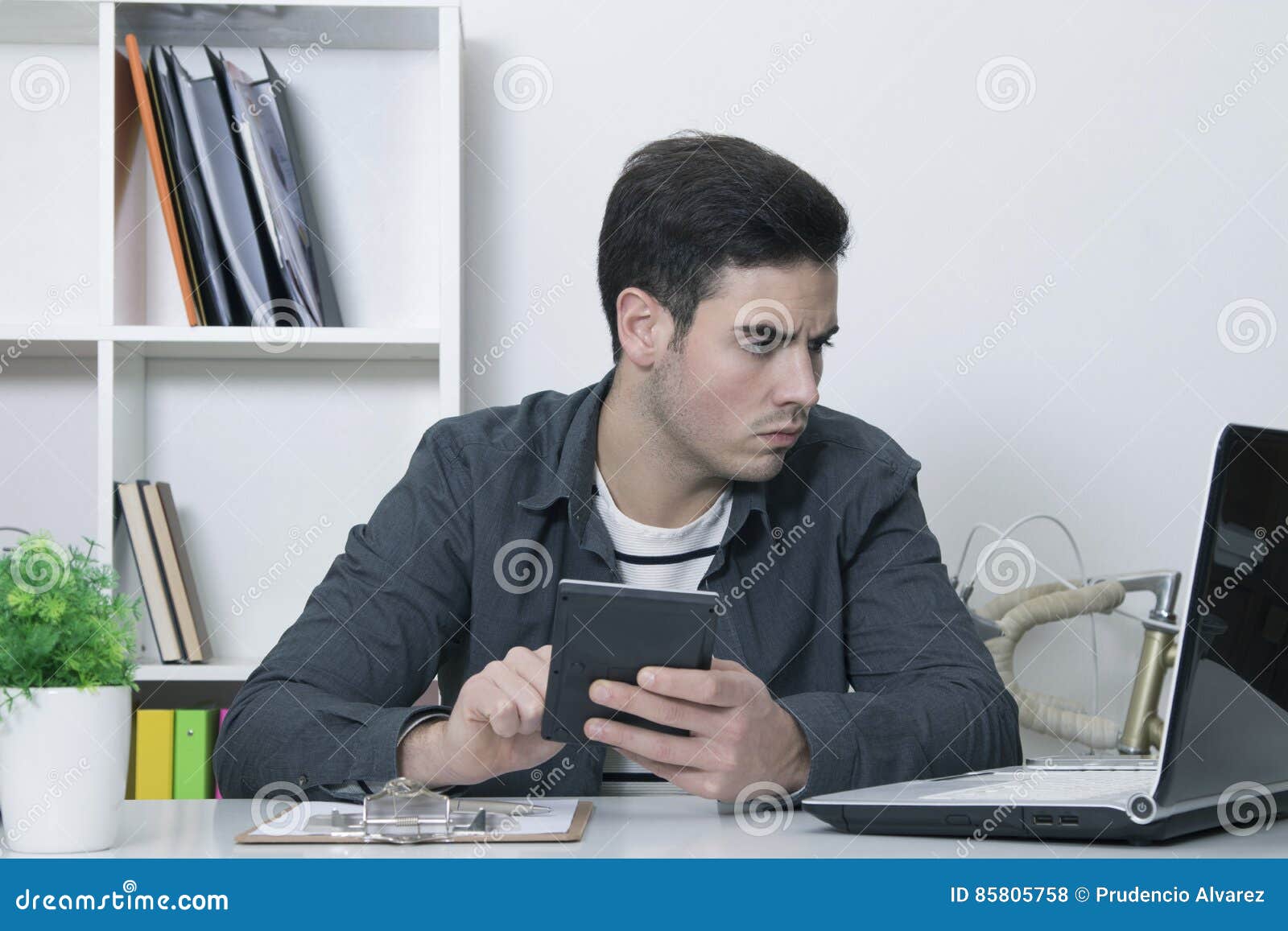 Man with the calculator stock photo. Image of apartment - 85805758