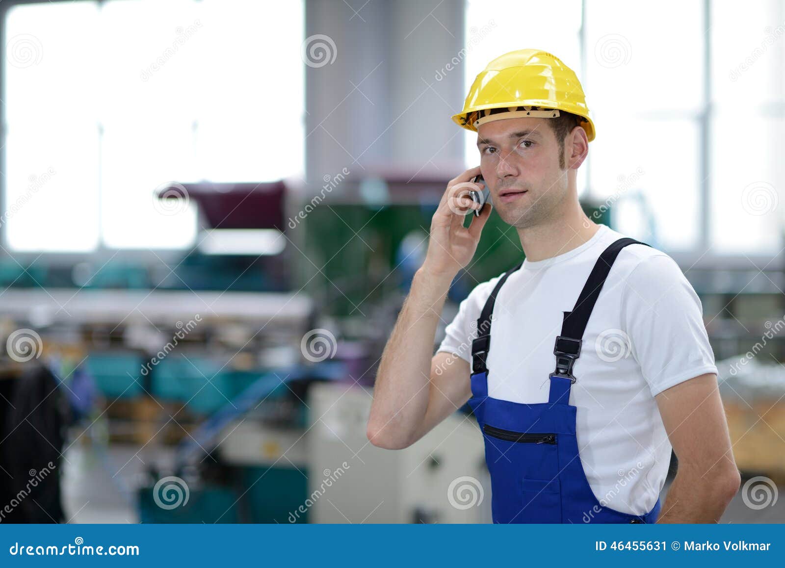 Man calling in factory stock image. Image of business - 46455631