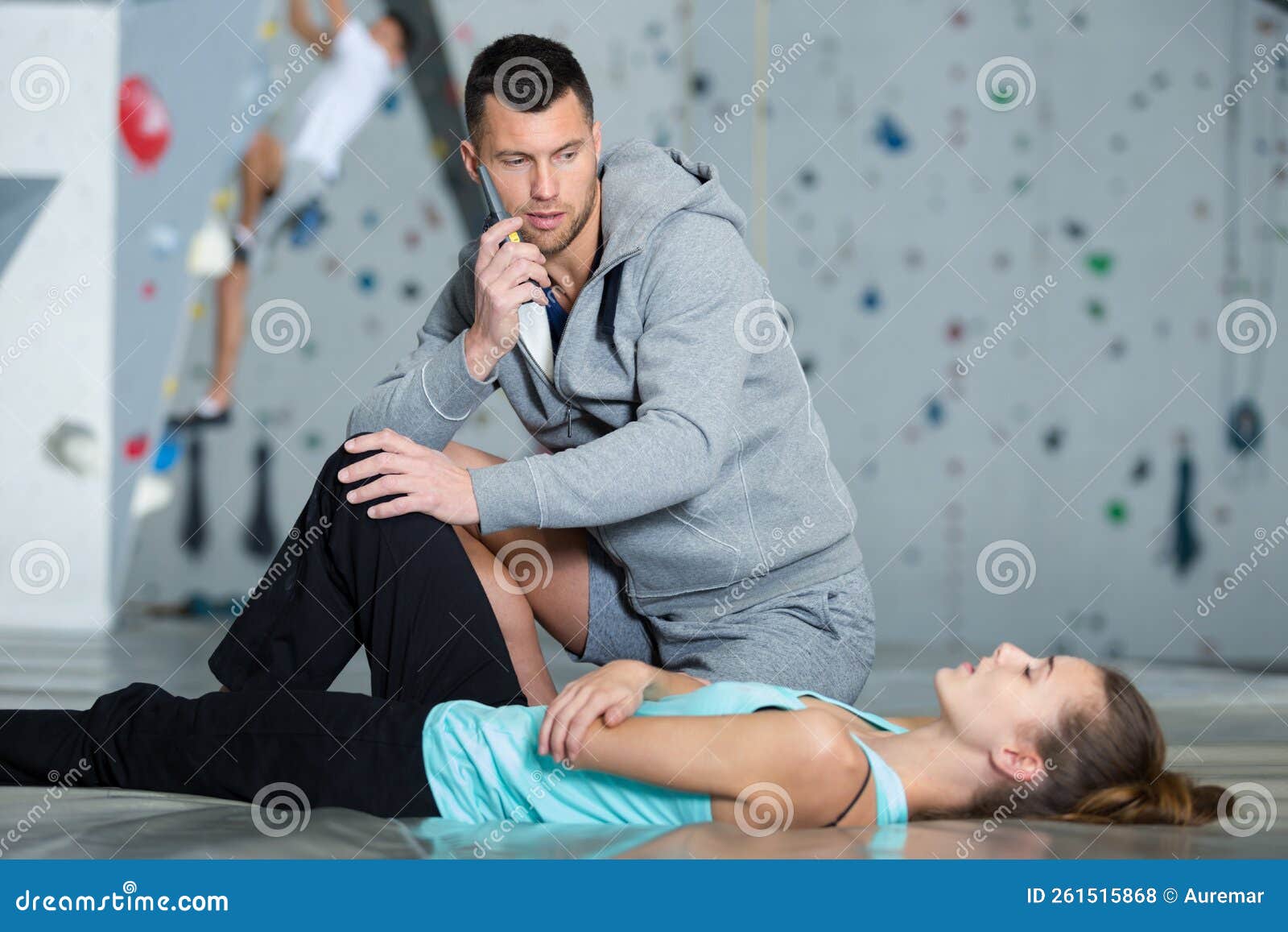 Man Calling for Help for Fallen Climber in Activity Center Stock Photo ...