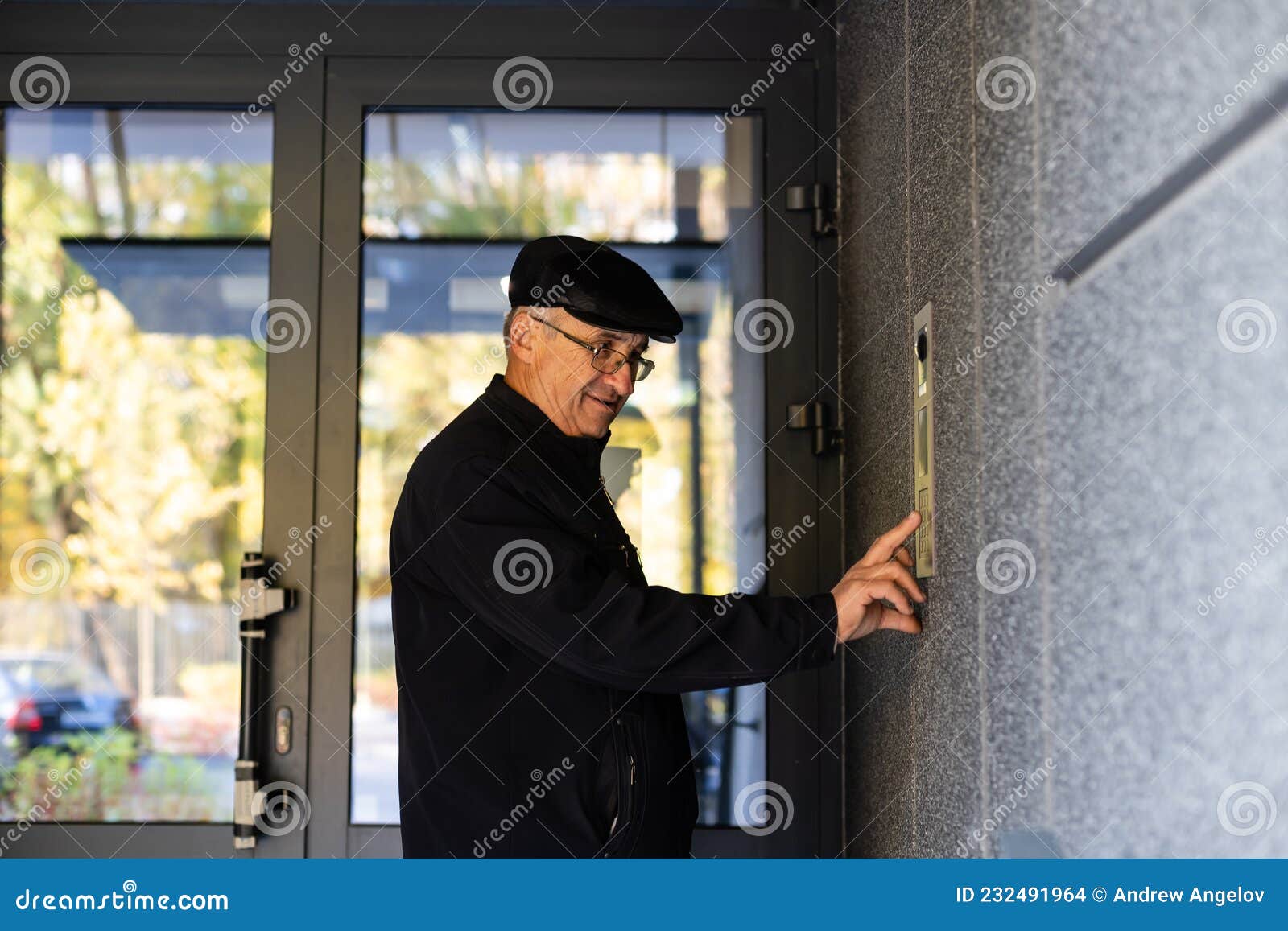 Man Calling by the Intercom, from an Apartment Building Stock Photo ...
