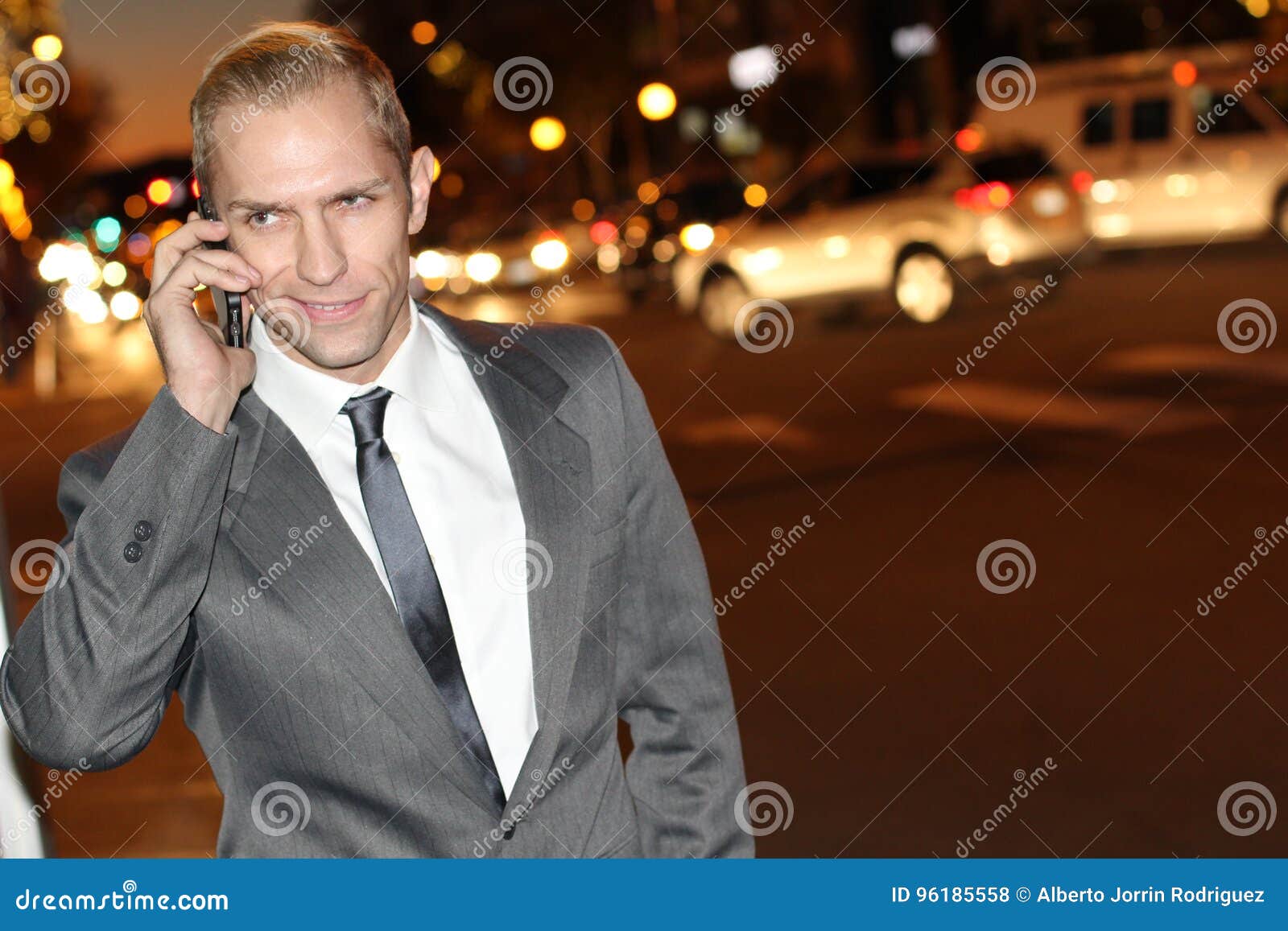 Man Calling by Phone Outdoors with an Evil Expression Stock Photo ...