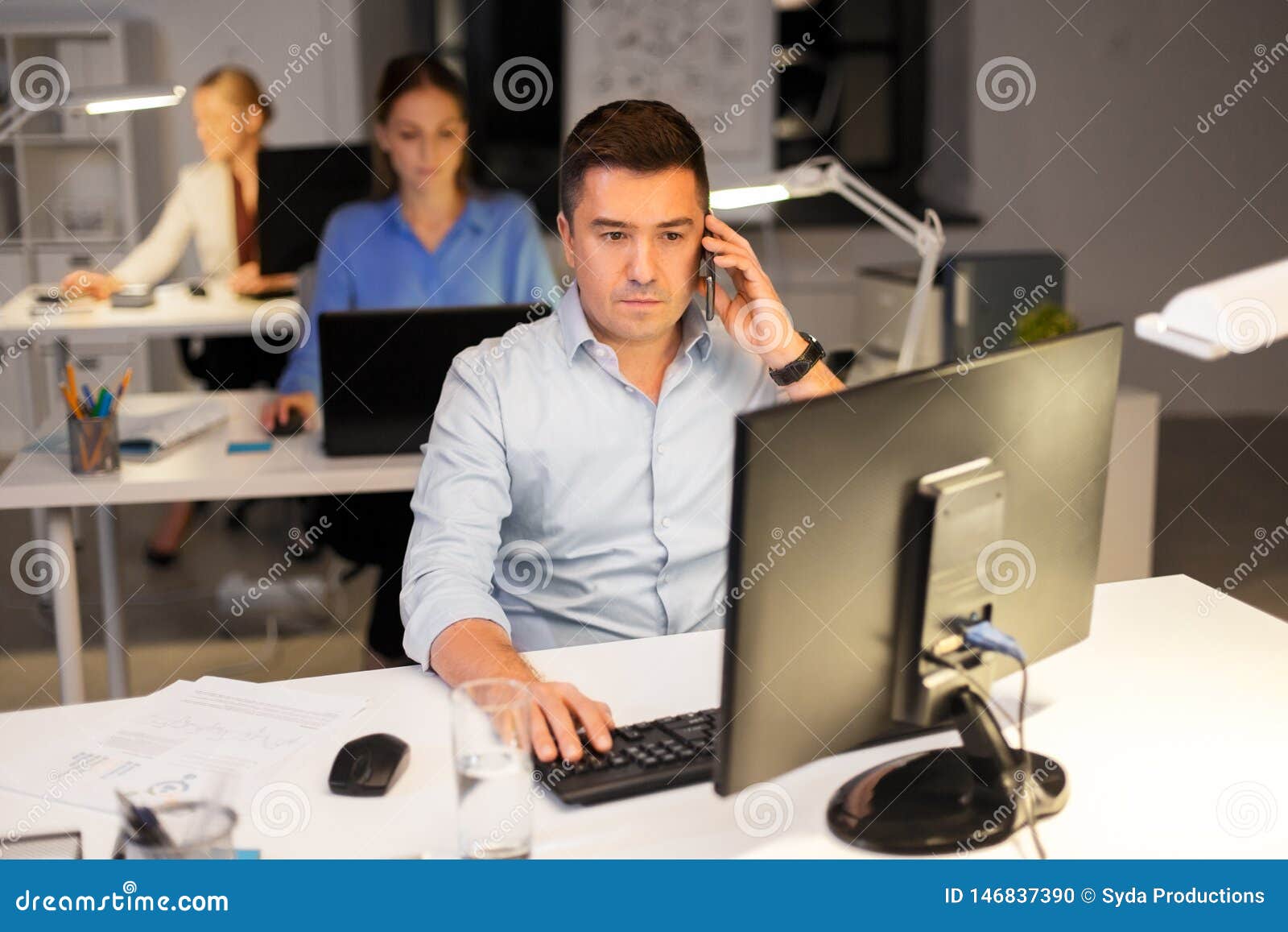 Man Calling on Smartphone at Night Office Stock Photo - Image of ...