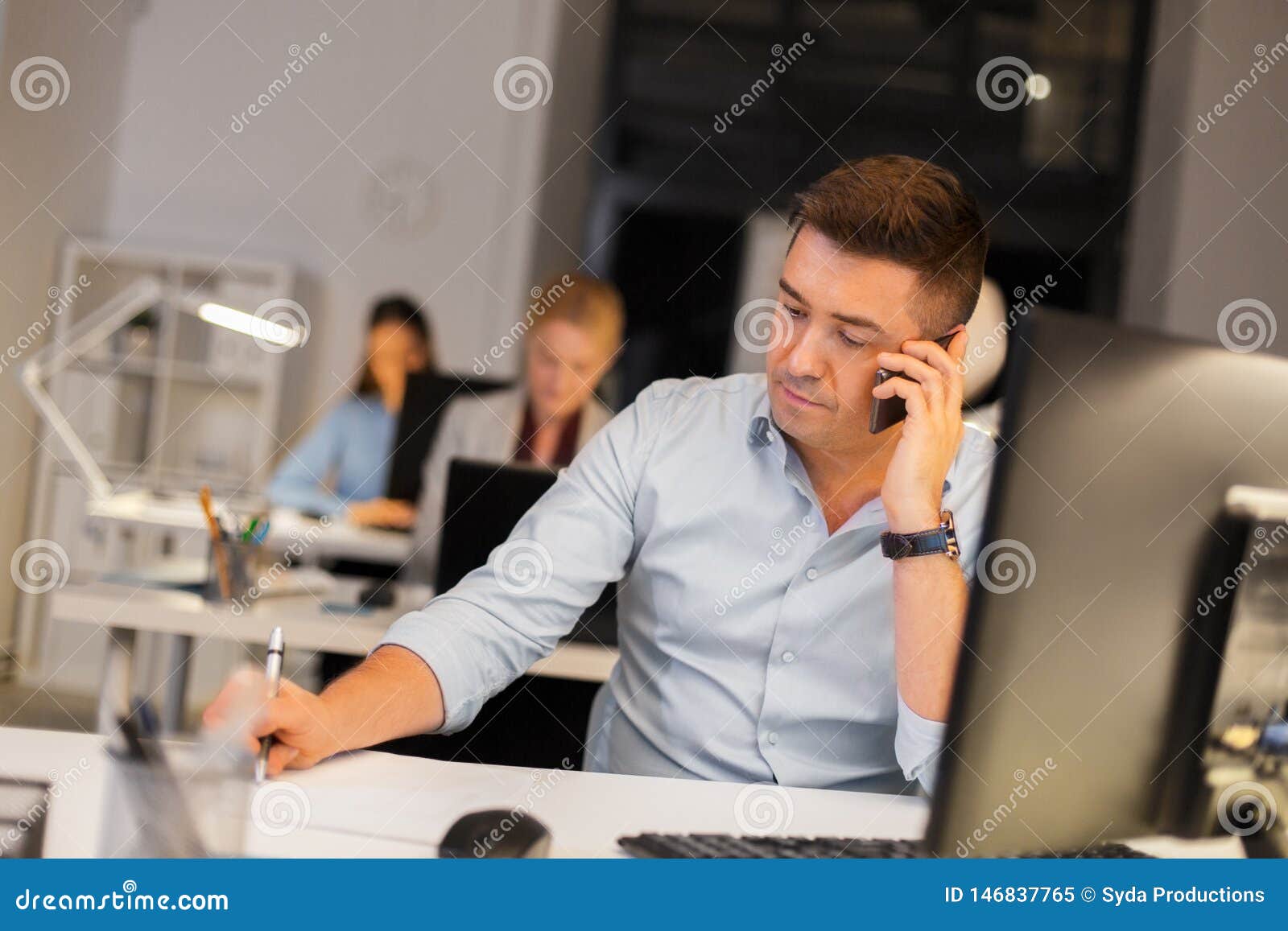 Man Calling on Smartphone at Night Office Stock Image - Image of dark ...