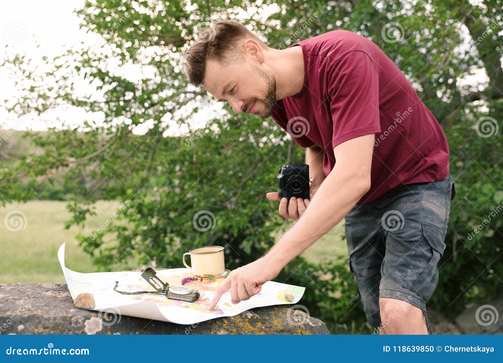 Man with Camera Exploring Map Outdoors Stock Photo - Image of camp ... Man with Camera Exploring Map Outdoors Stock Photo - Image of camp ...