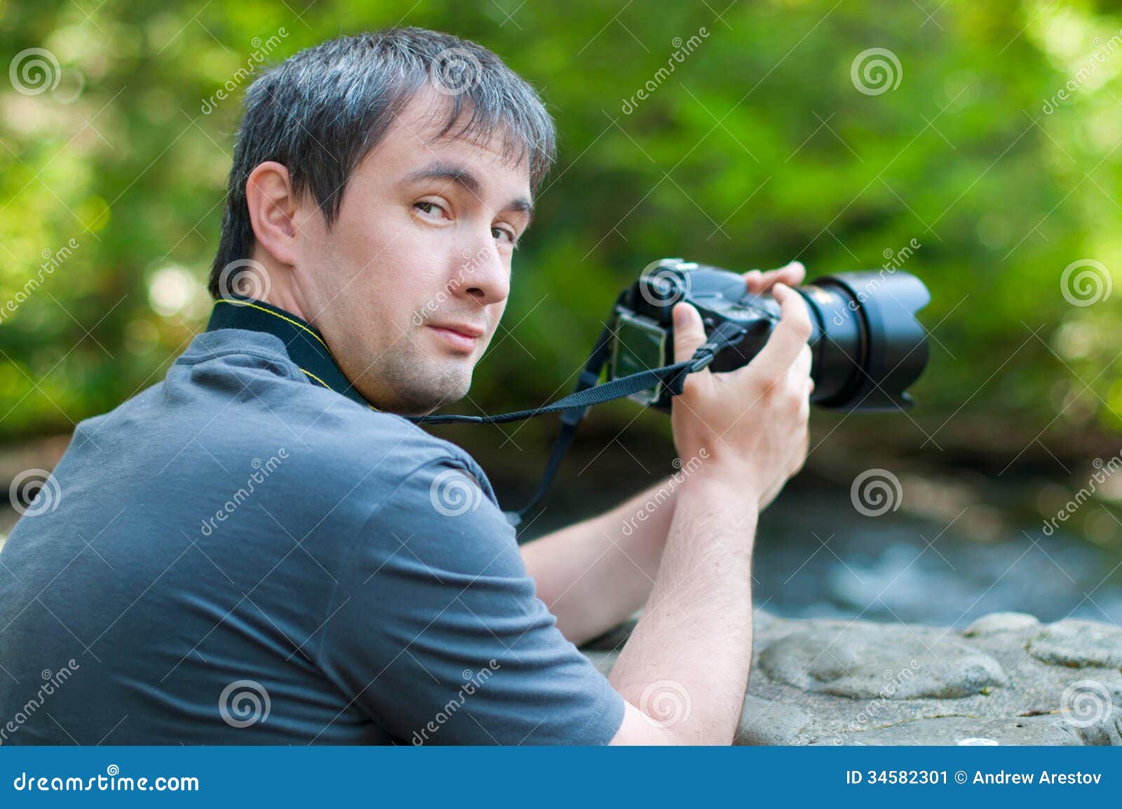 A man with a camera stock image. Image of park, pretty - 34582301