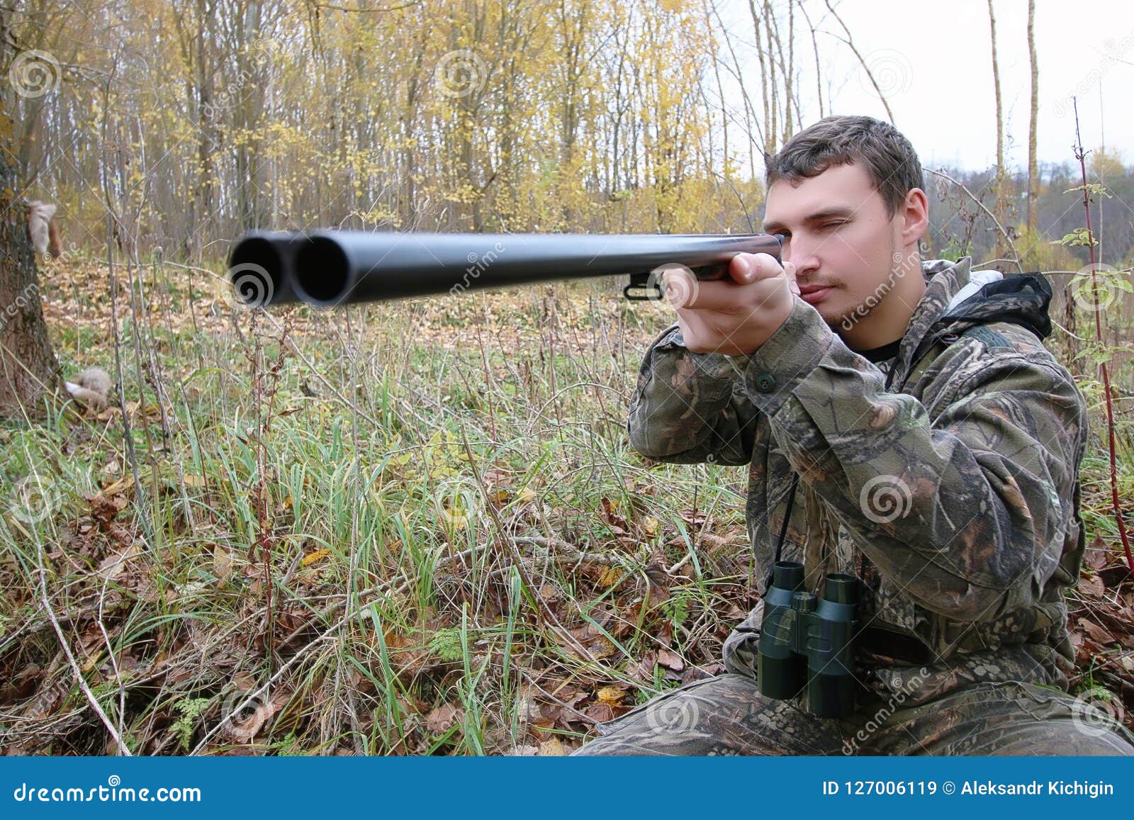 Man in Camouflage and with Guns in a Forest Belt on a Spring Hun Stock ...