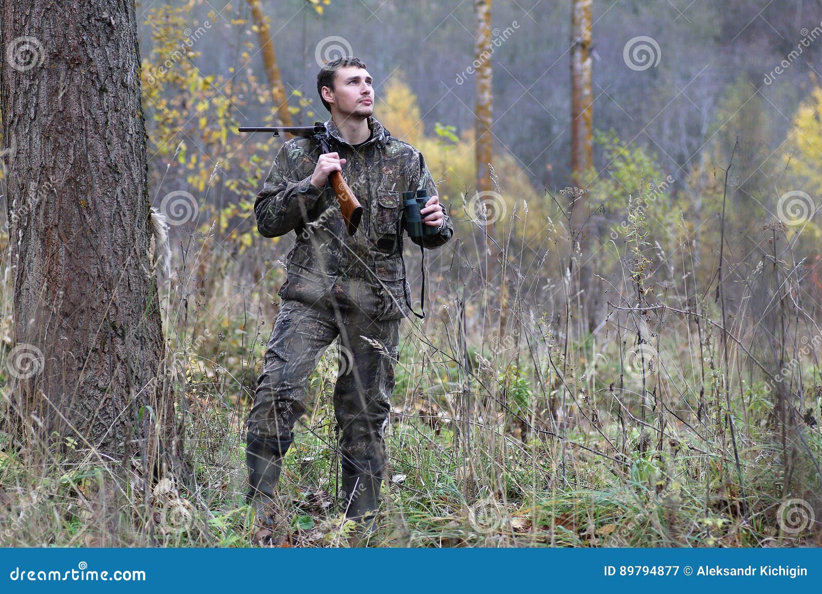 Man in Camouflage and with Guns in a Forest Belt on a Spring Hun Stock ...