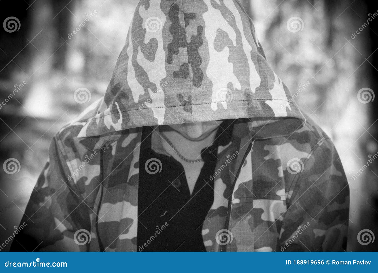 A Man in Camouflage with a Hood Pulled Down Stock Photo - Image of ...