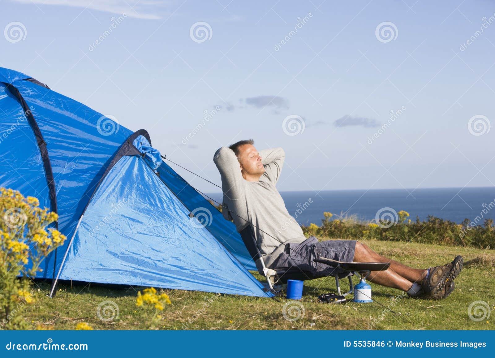 Man Camping Outdoors and Cooking Stock Photo - Image of ground, gear ...