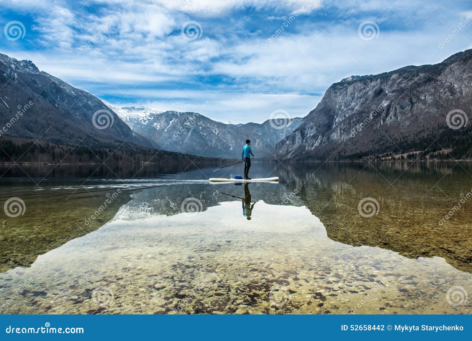 Man on a Canoe on a Mountain Lake Stock Photo - Image of peaceful ...
