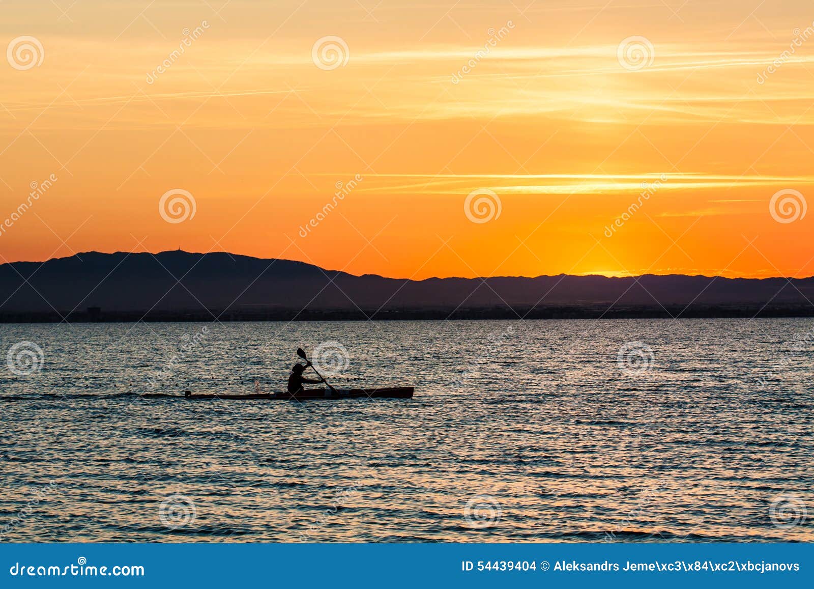 Man canoeing on sunset stock photo. Image of colored - 54439404