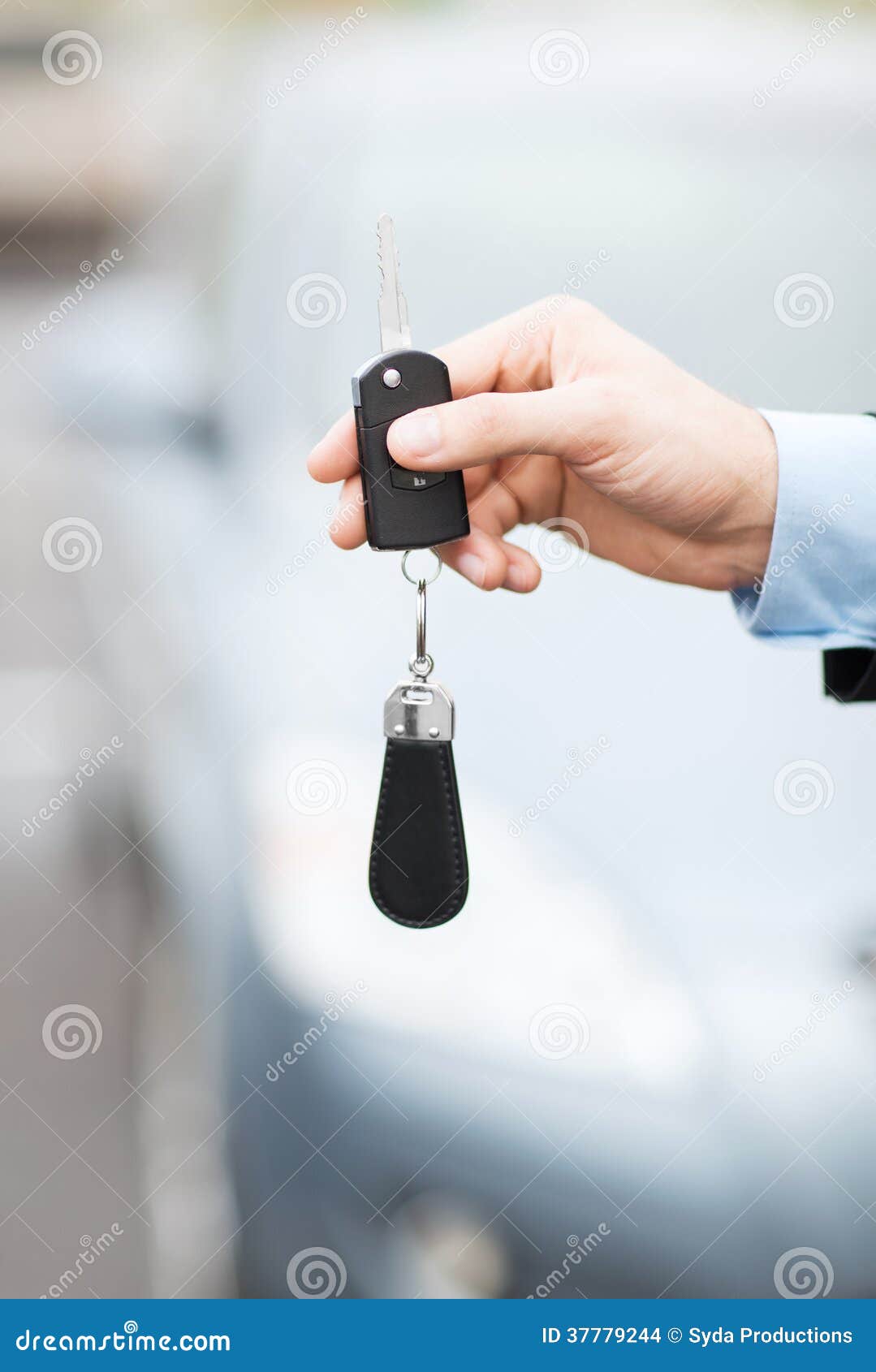 Man with car key outside stock photo. Image of locking - 37779244