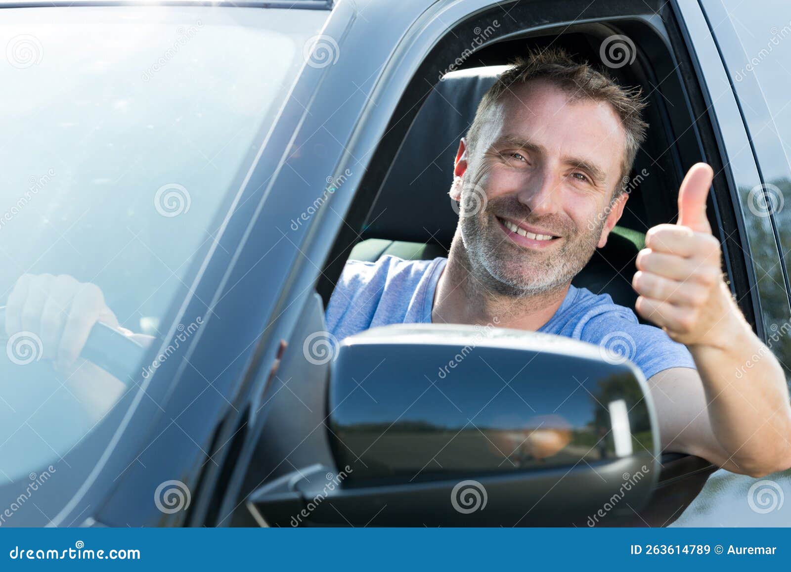 Man in car with thumbs up stock image. Image of automobile - 263614789