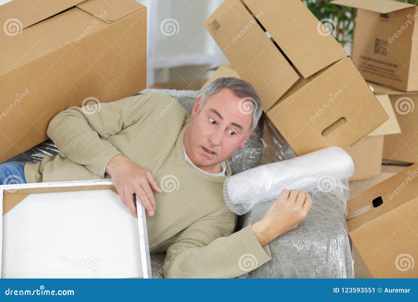 Man in cardboard box stock image. Image of domestic - 123593551