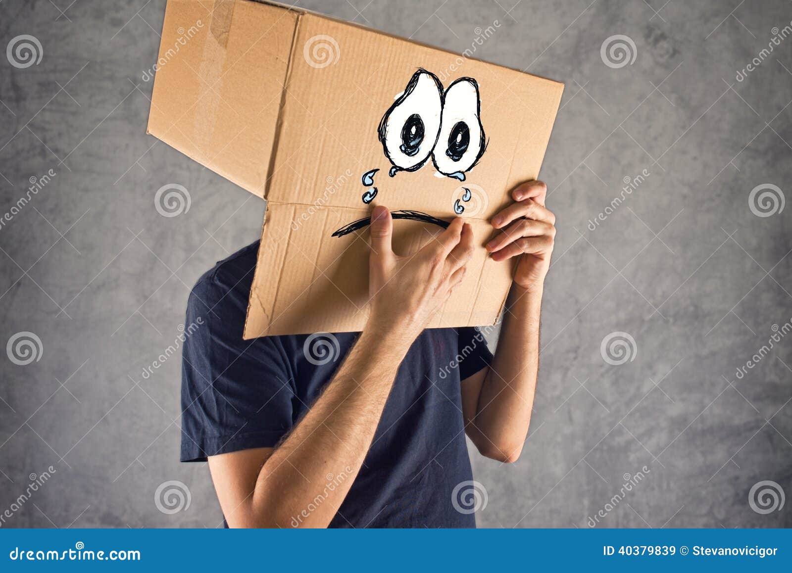Man With Cardboard Box On His Head And Sad Face Expression Stock Image ...