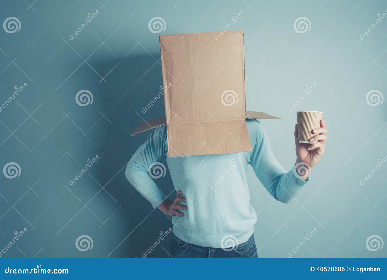 Man with Cardboard Box Over Head and a Cup Stock Photo - Image of ...
