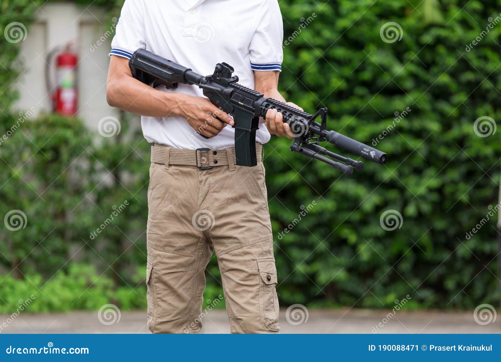 Man in Cargo Pants with Gun Stock Image - Image of brown, enforcement ...