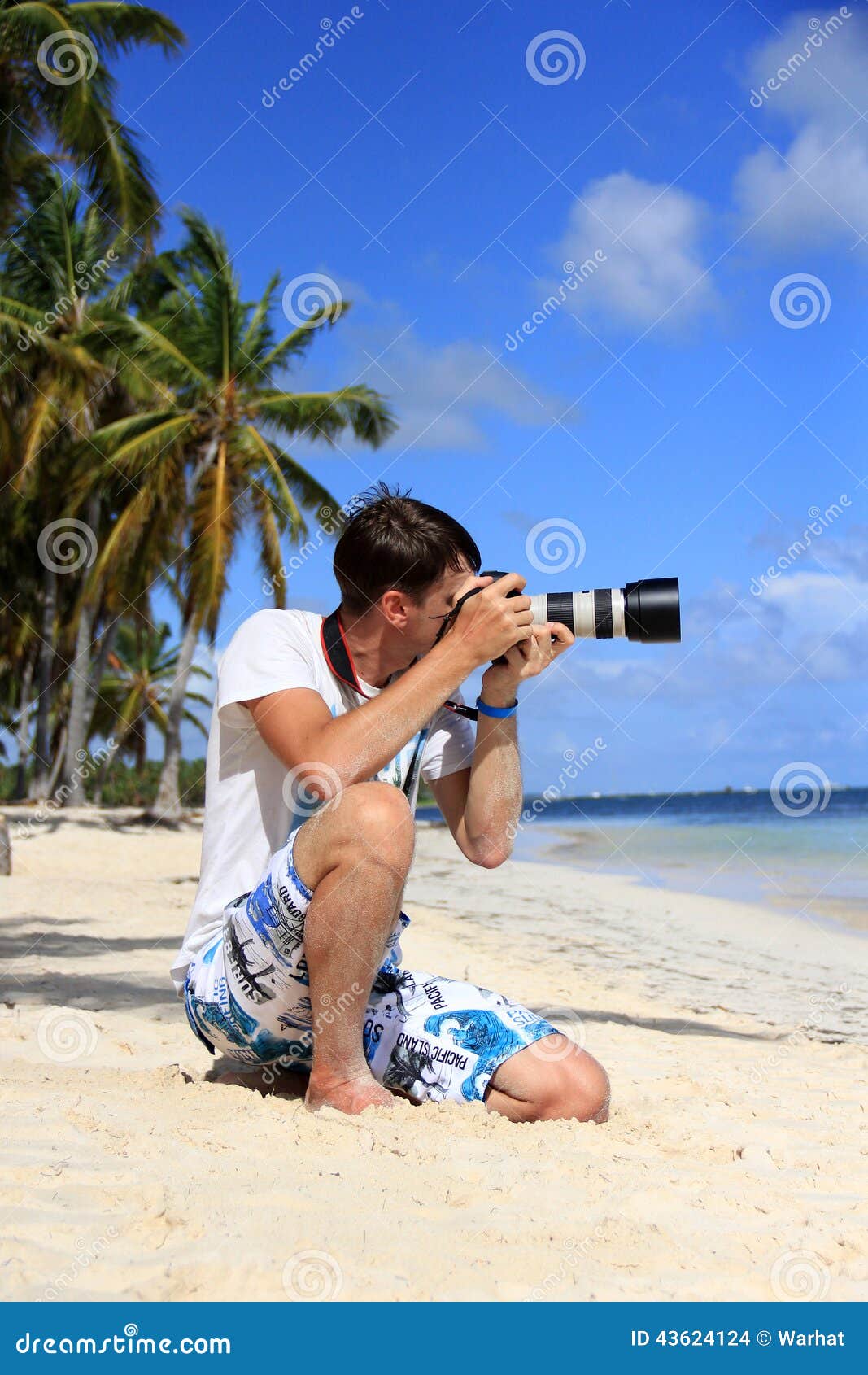 Man on the Caribbean Beach with a Camera Stock Photo - Image of ...