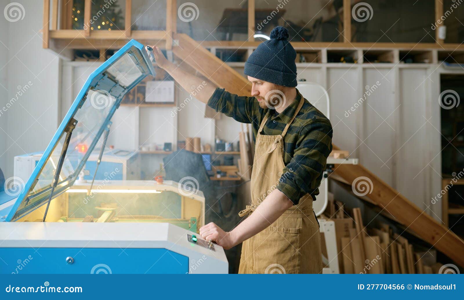 Man Carpenter Operating CNC Laser Machine in Automated Woodworking ...