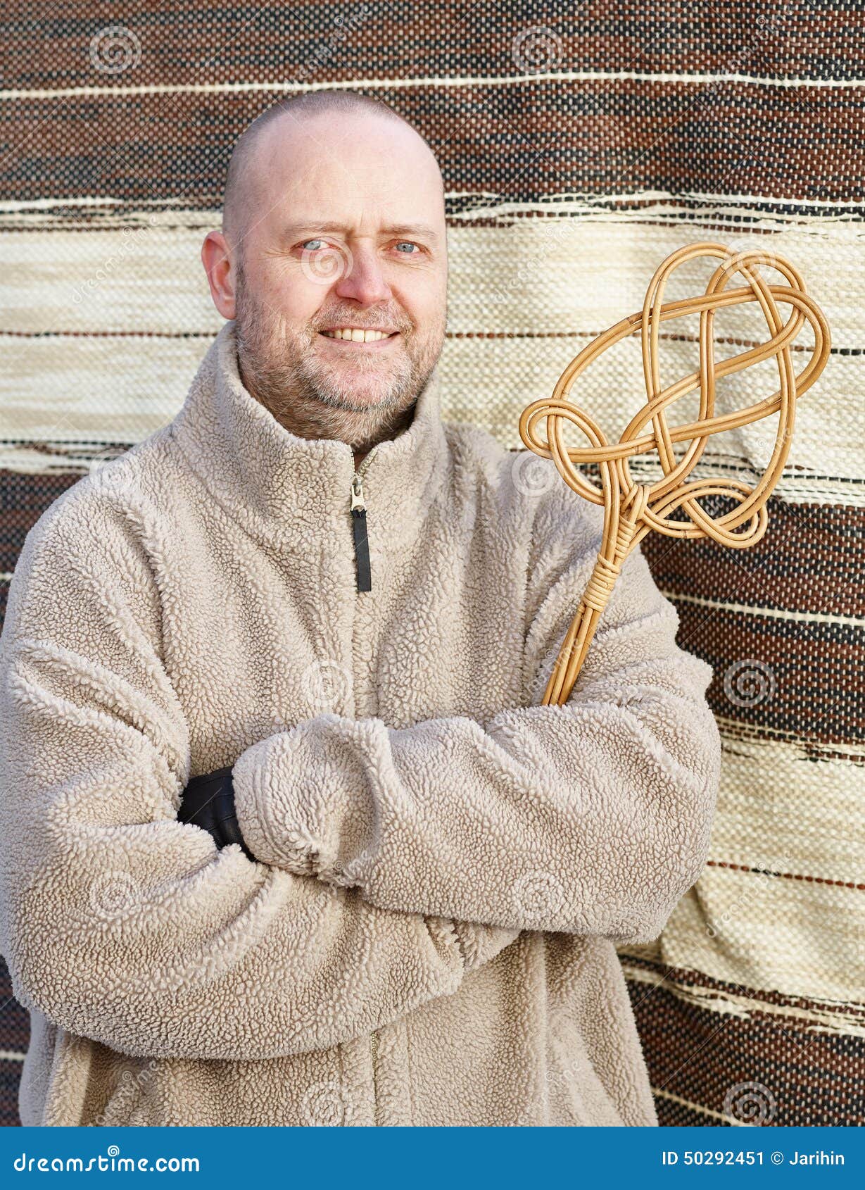 Man and carpet beater stock image. Image of warm, beard - 50292451