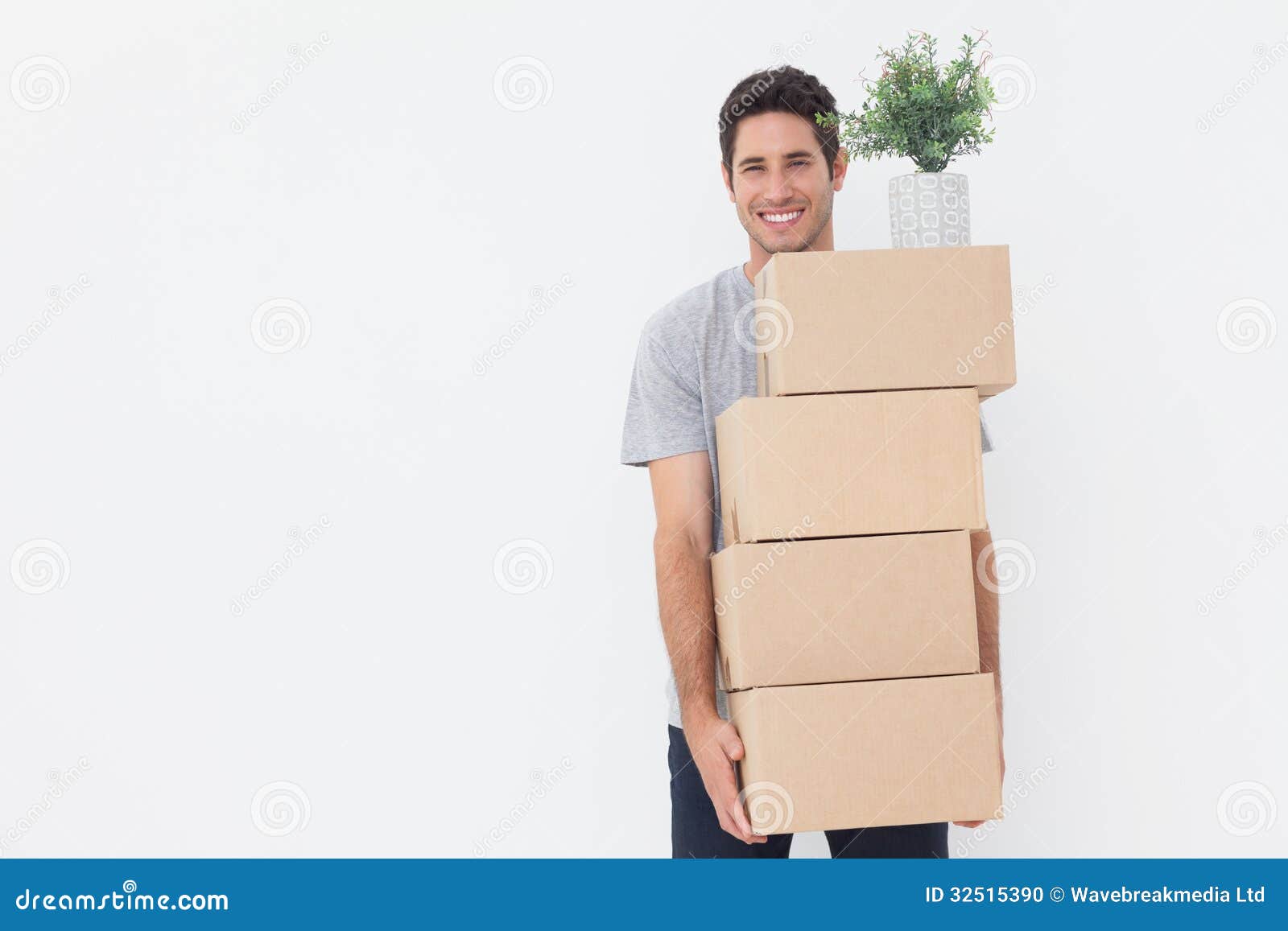 Man Carrying Boxes because he is Moving in a New House Stock Photo ...
