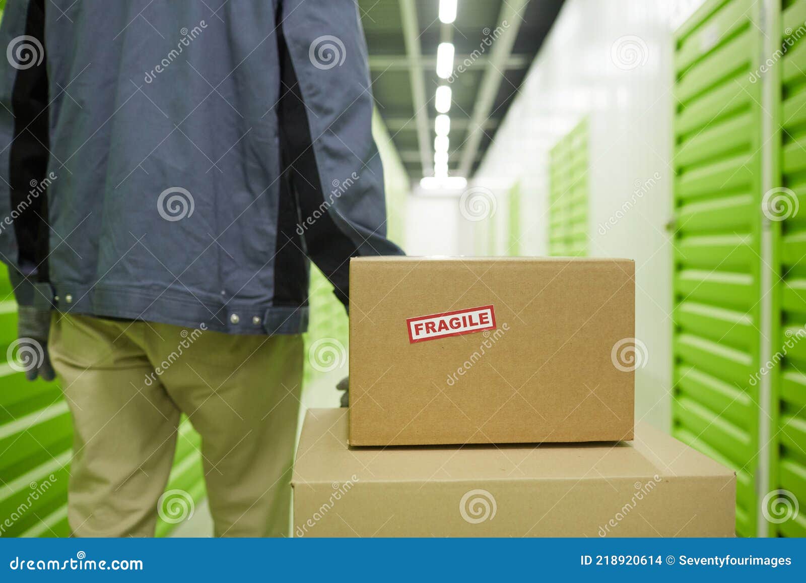Man Carrying Boxes in Storage Stock Photo - Image of service, working ...