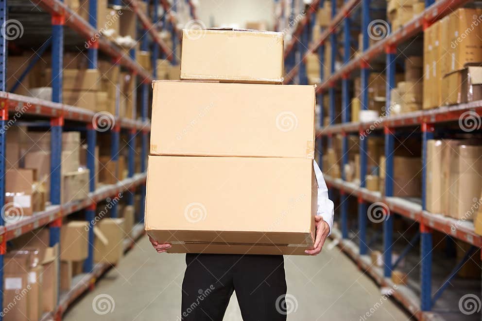 Man Carrying Boxes in Warehouse Stock Photo - Image of business ...