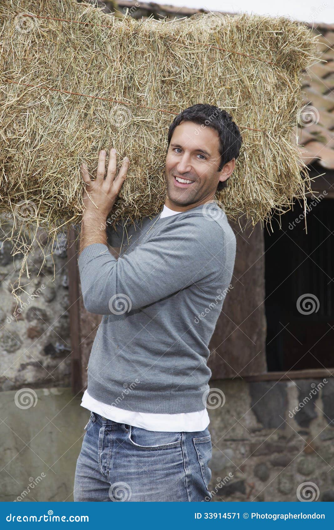 Man Carrying Hay on Shoulders Stock Image - Image of rural, country ...