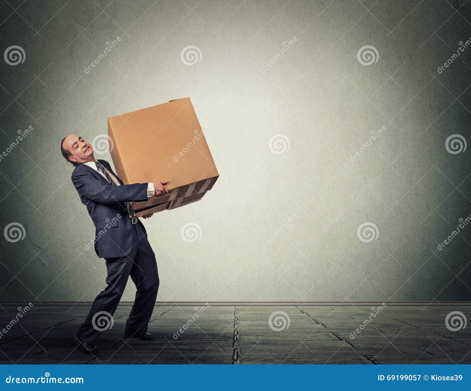 Man carrying heavy box stock image. Image of pile, lift - 69199057