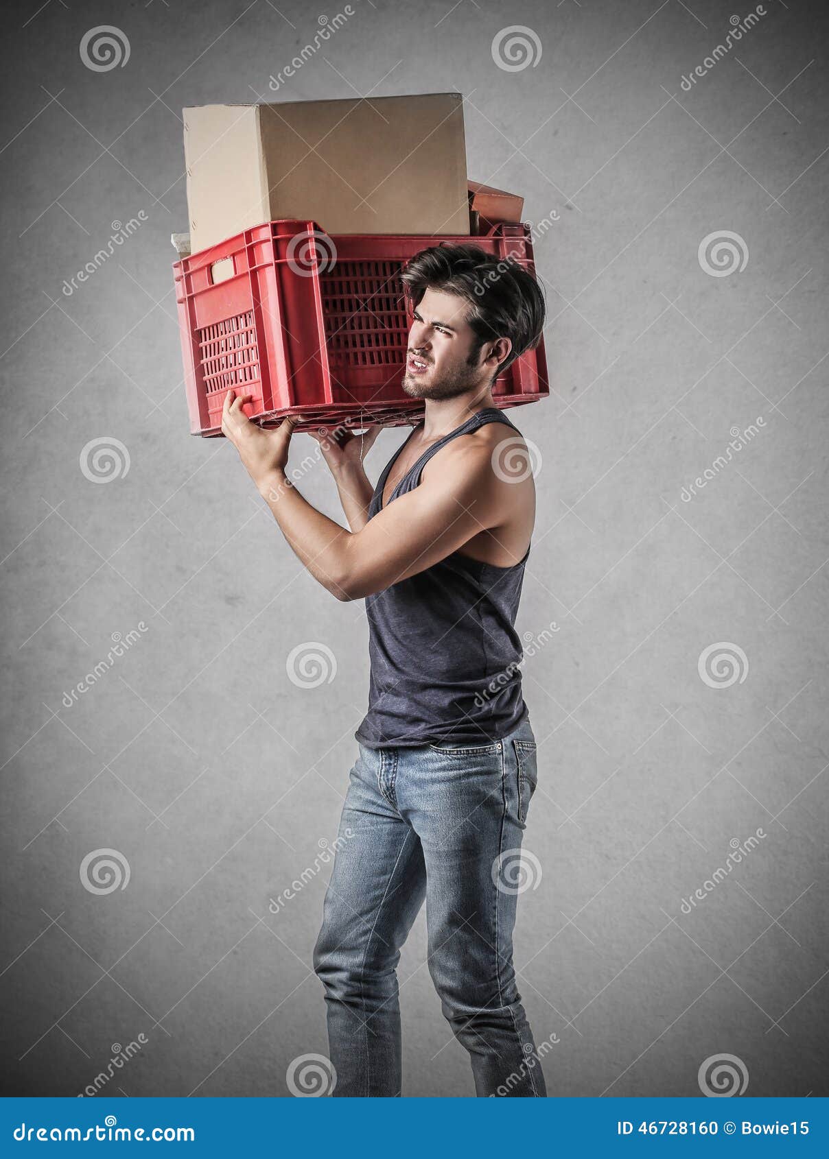 Man carrying a heavy box stock photo. Image of travel - 46728160