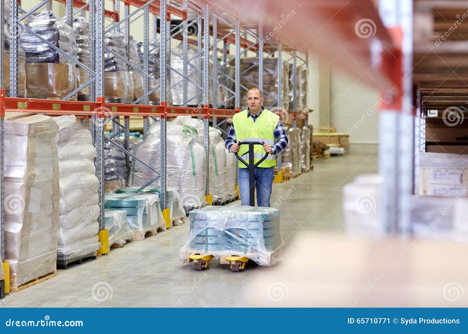 Man Carrying Loader with Goods at Warehouse Stock Image - Image of ...