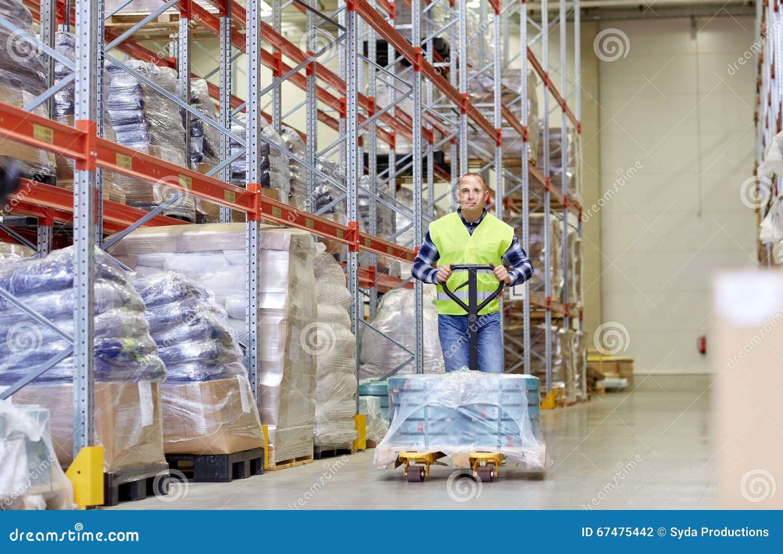 Man Carrying Loader with Goods at Warehouse Stock Photo - Image of ...