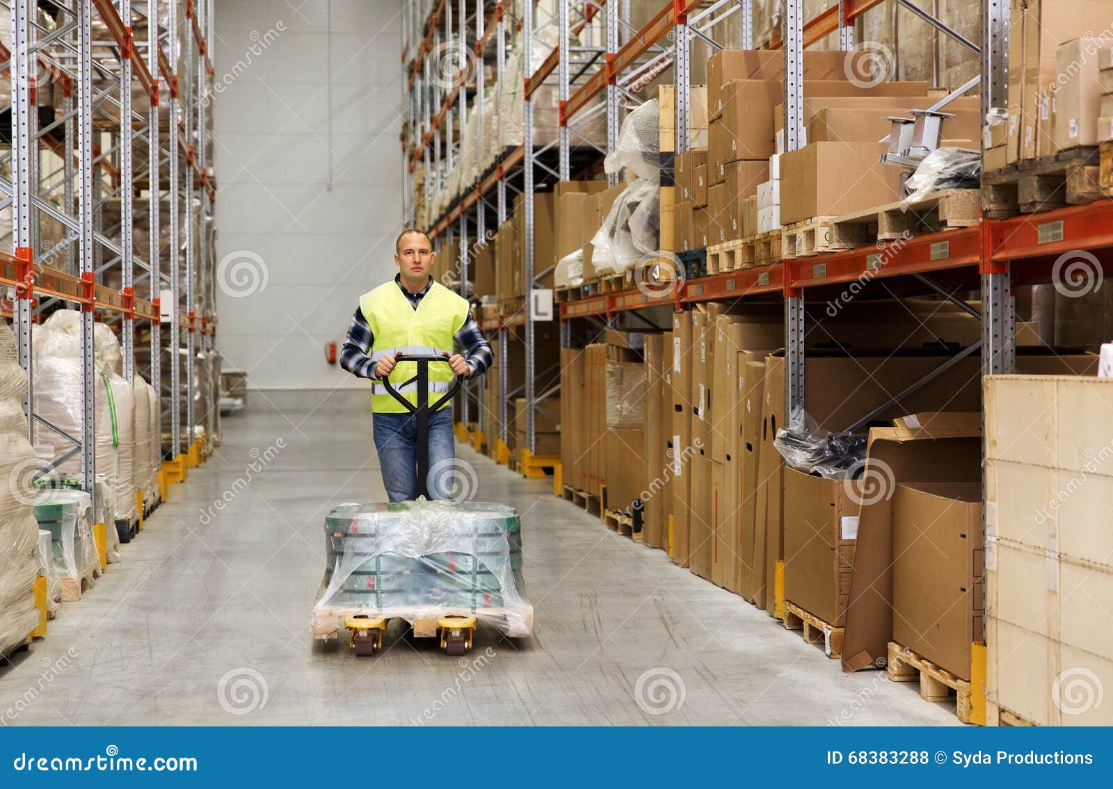 Man Carrying Loader with Goods at Warehouse Stock Photo - Image of ...