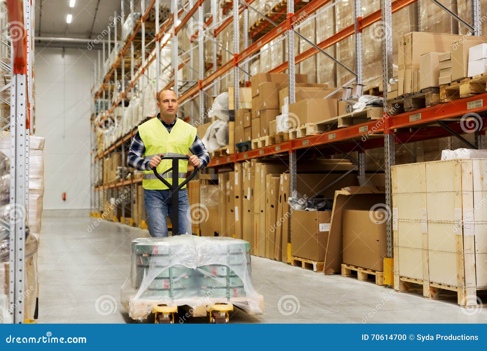 Man Carrying Loader with Goods at Warehouse Stock Photo - Image of ...