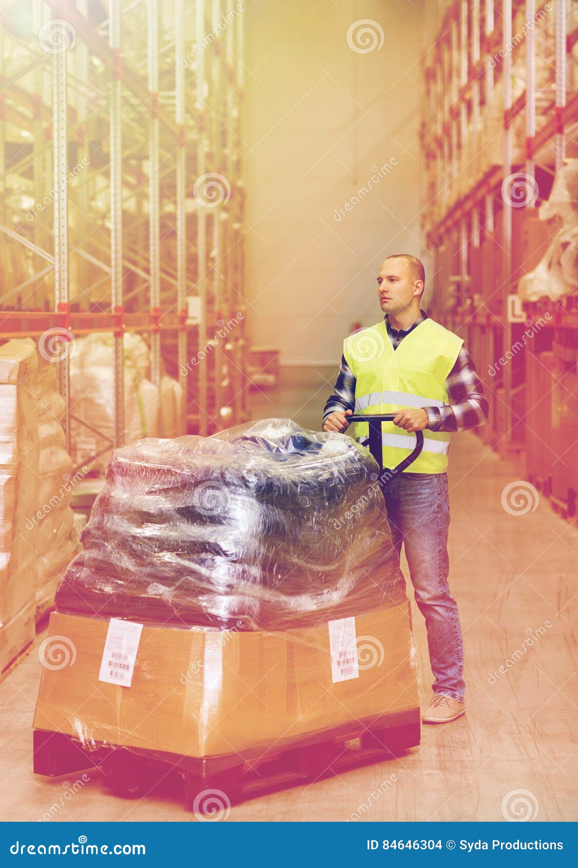 Man Carrying Loader with Goods at Warehouse Stock Photo - Image of pile ...